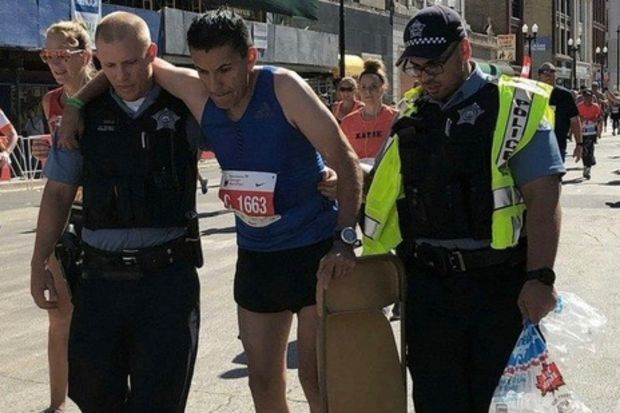 Police Officers Describe Helping Injured Marathon Runner Finish Race ...